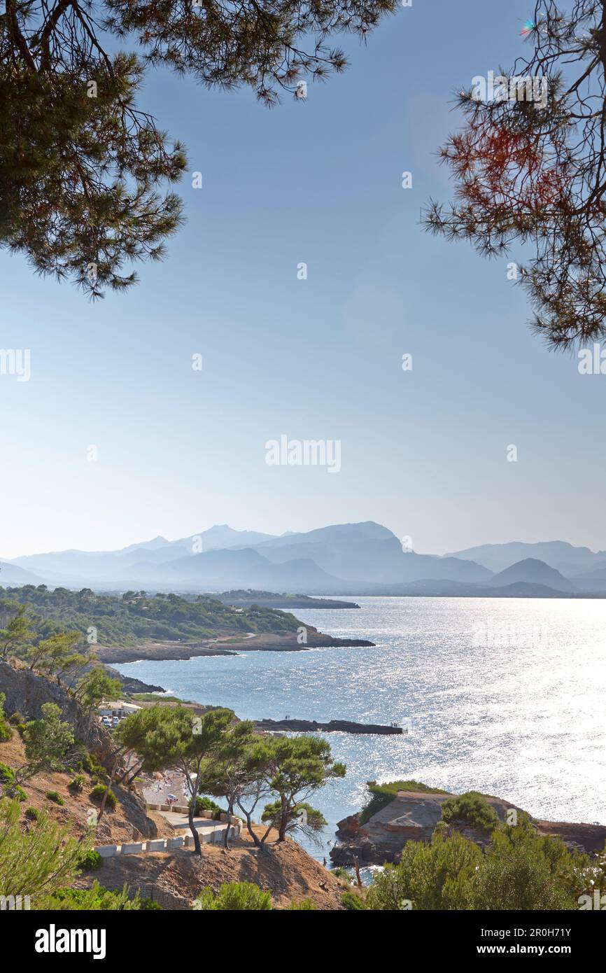 Coastal road leading to S'Illot chapel, view over Playa S'Illot beach ...