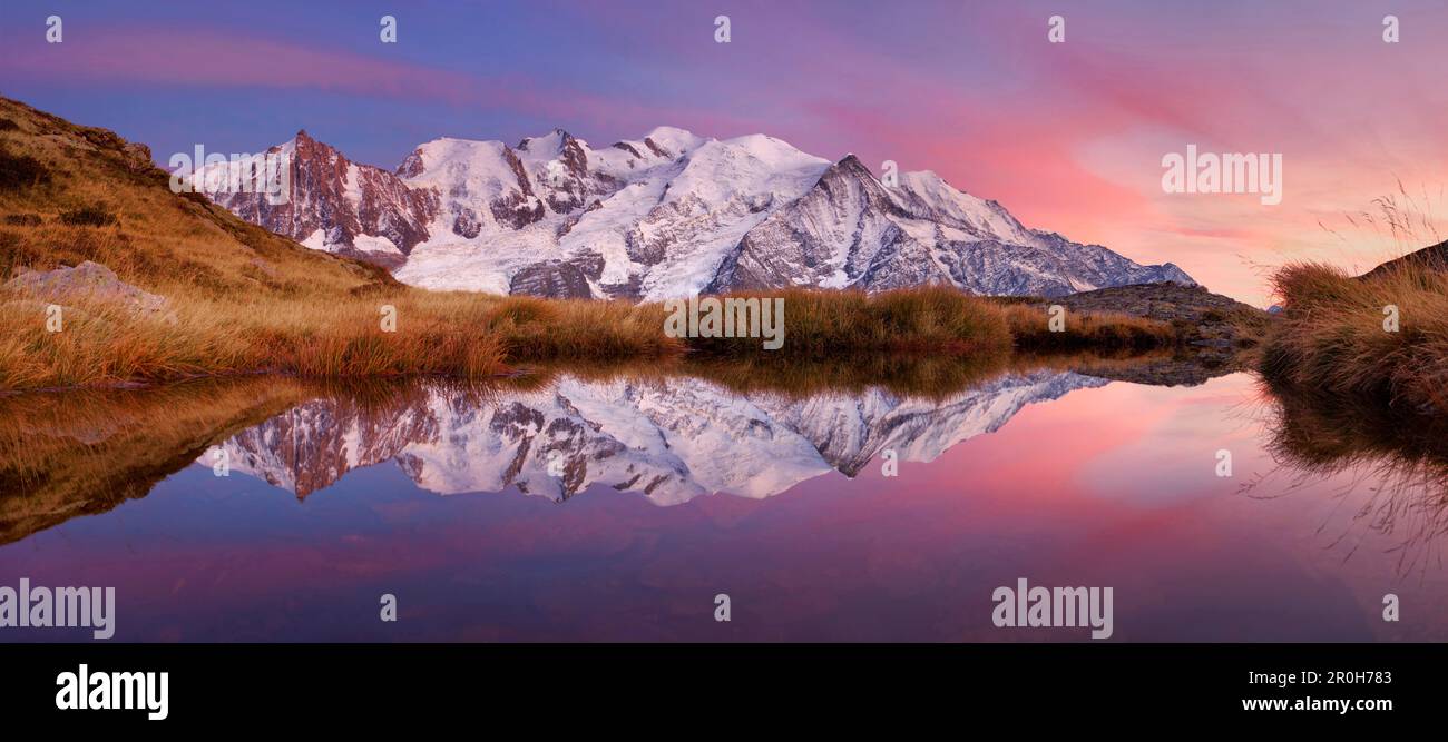 Sunset above the Mont Blanc Massif and its reflection in a small ...