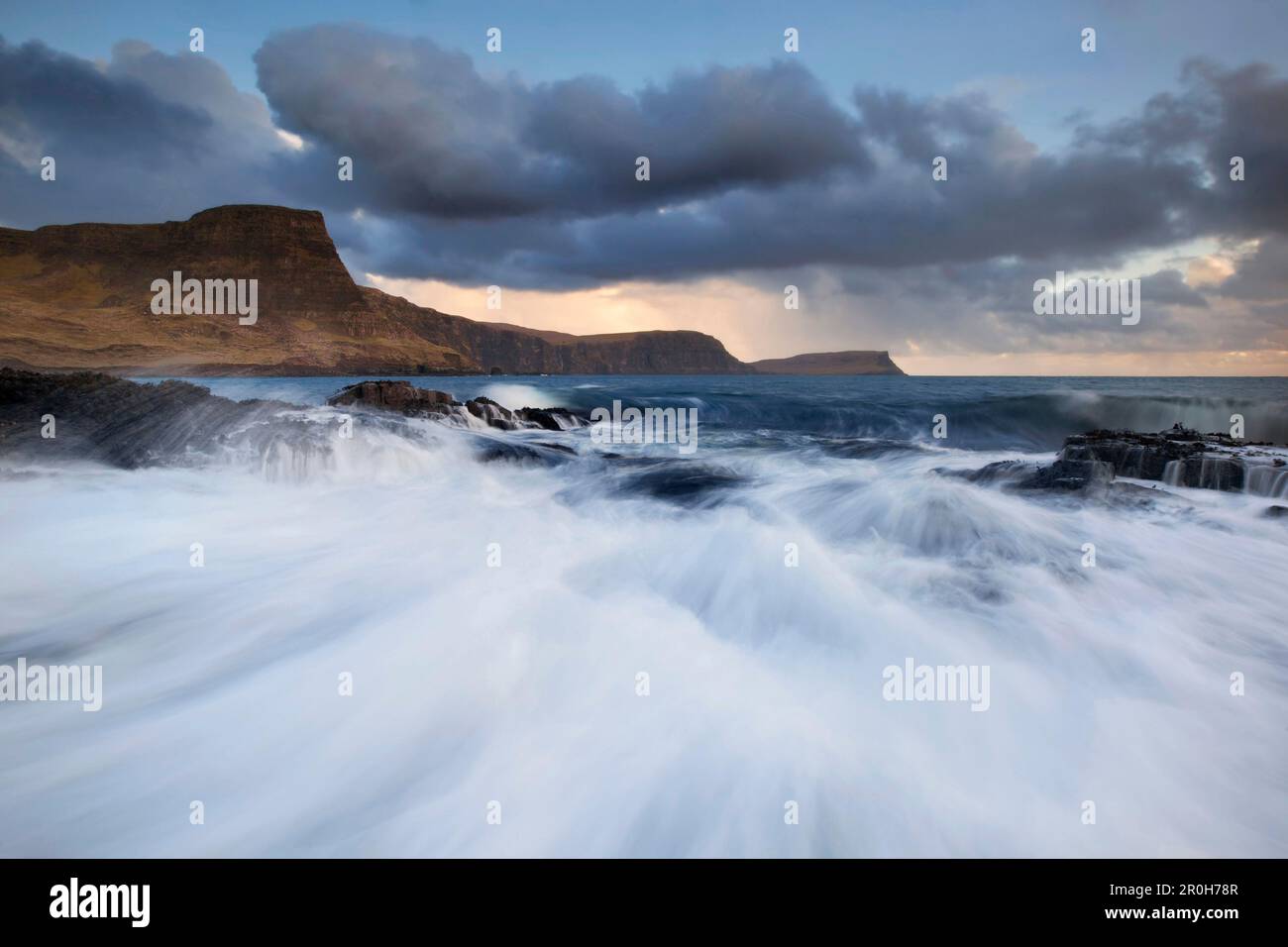 Incoming surf with view to the impressive cliffs of Waterstein head at ...