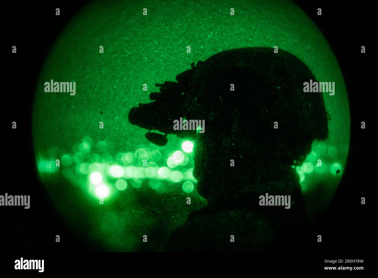 A special operations forces soldier provides rear security during a ...