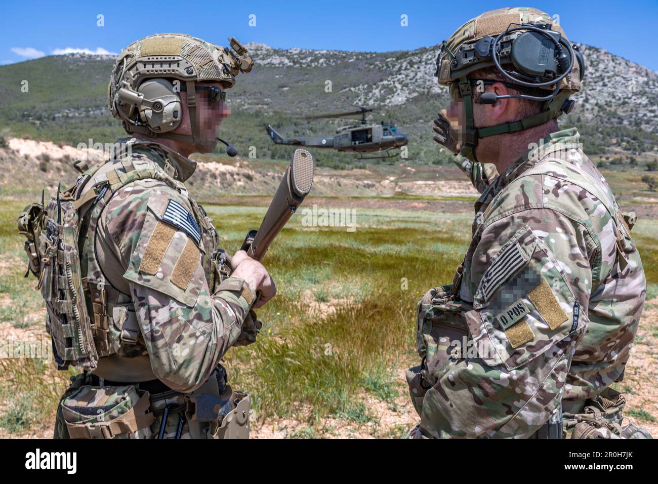 A Hellenic special operations forces officer briefs a U.S. SOF soldier during an airborne sniper ...