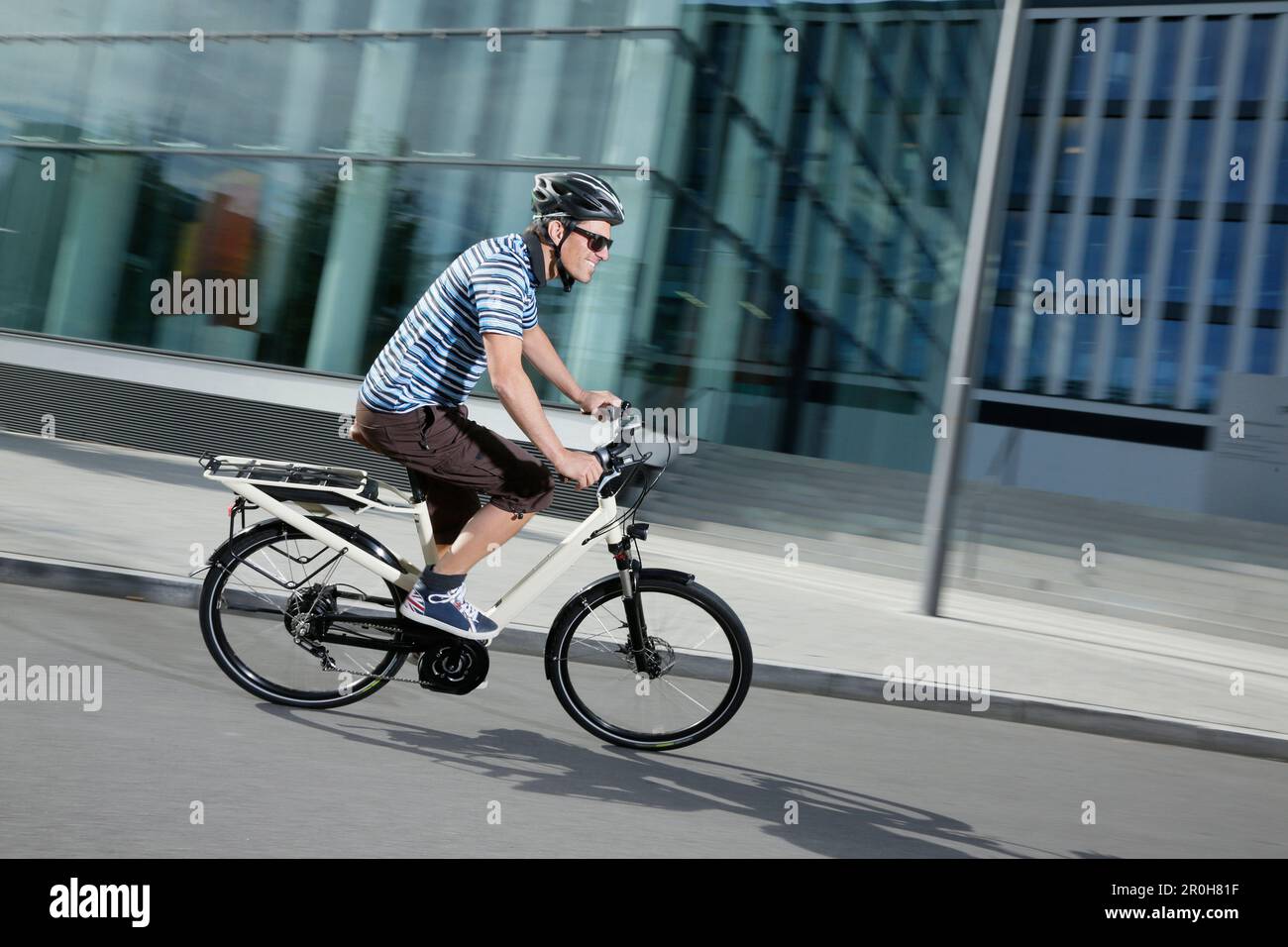 Man riding an e-bike, Munich, Bavaria, Germany Stock Photo - Alamy