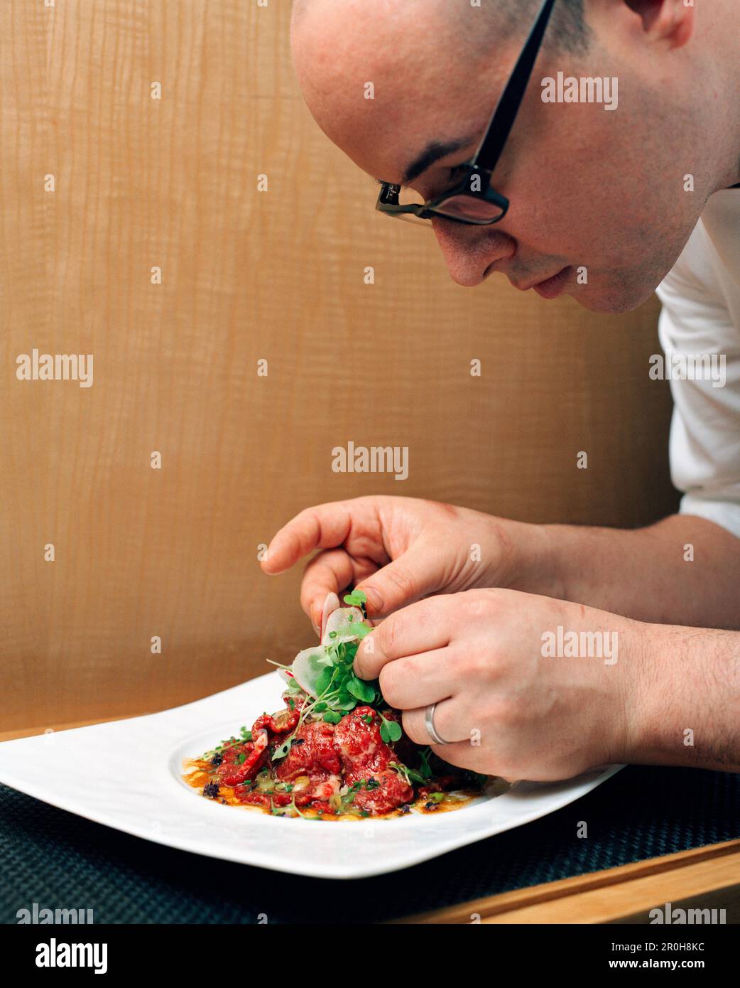 USA, California, Los Angeles, chef plating steak tartar at CUT ...