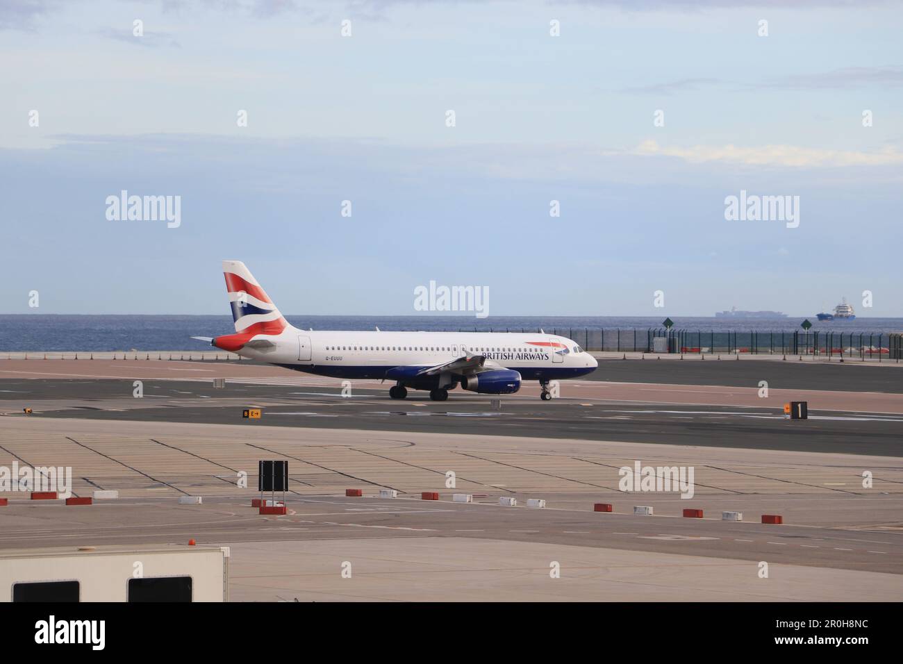 An airplane on a concrete runway Stock Photo - Alamy
