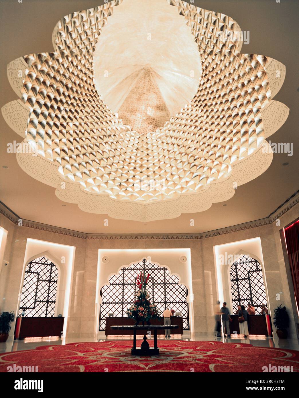 OMAN, Muscat, people standing in lobby at Barr Al Jissah Resort and Spa ...
