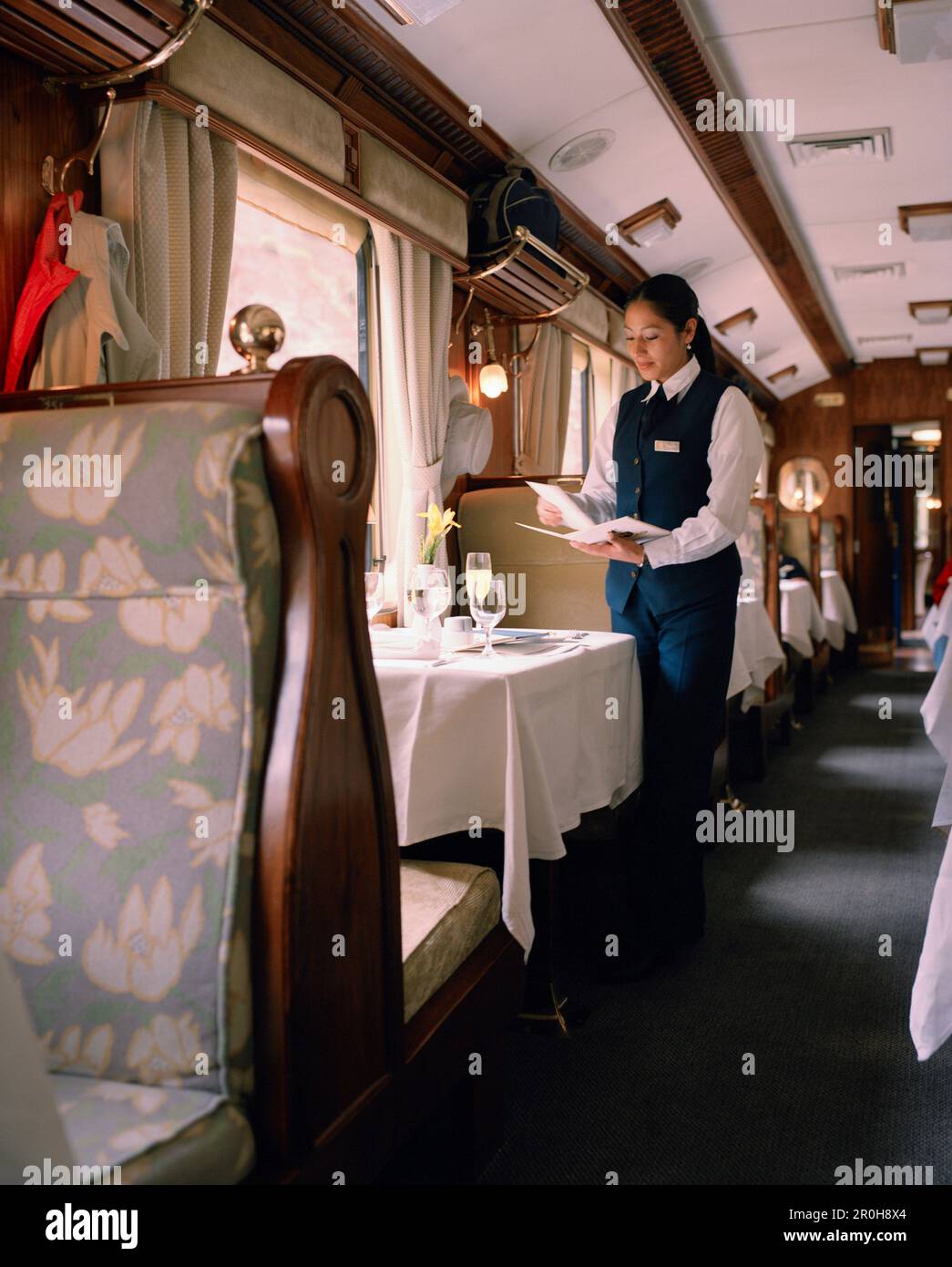 PERU, Cusco, South America, Latin America, waitress holding menu in ...