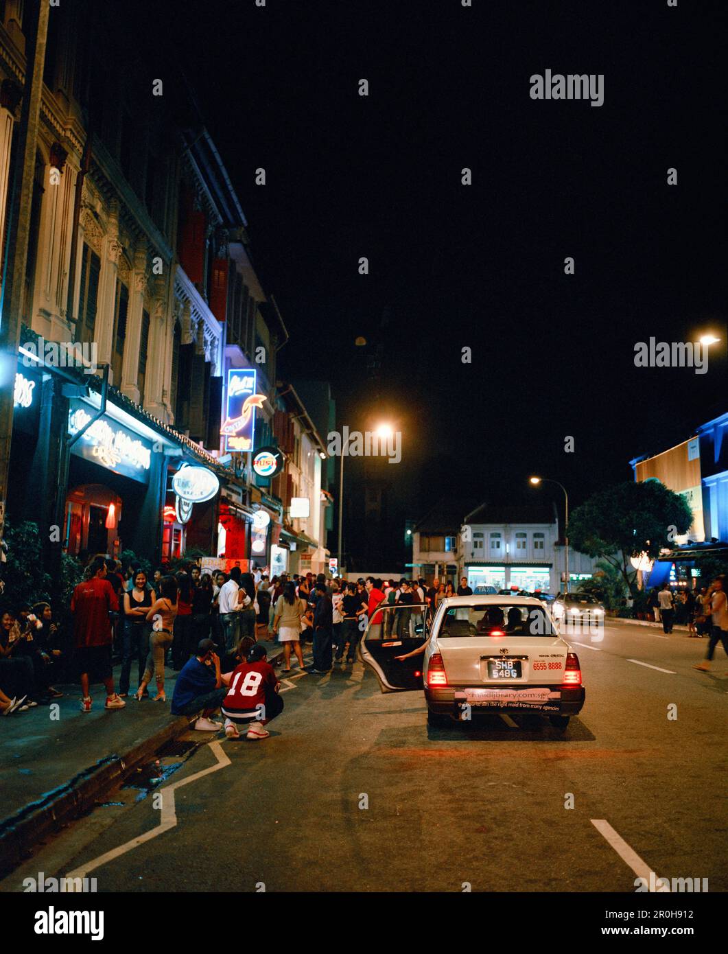 SINGAPORE, Asia, people waiting outside bar at Mohammed Sultan road at ...