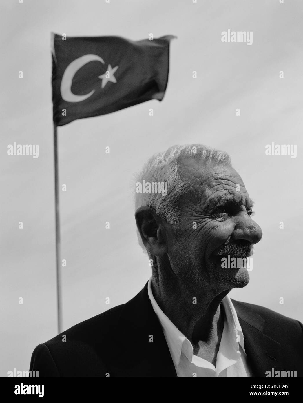 TURKEY, Istanbul, mature fisherman smiling with Turkish flag in the ...