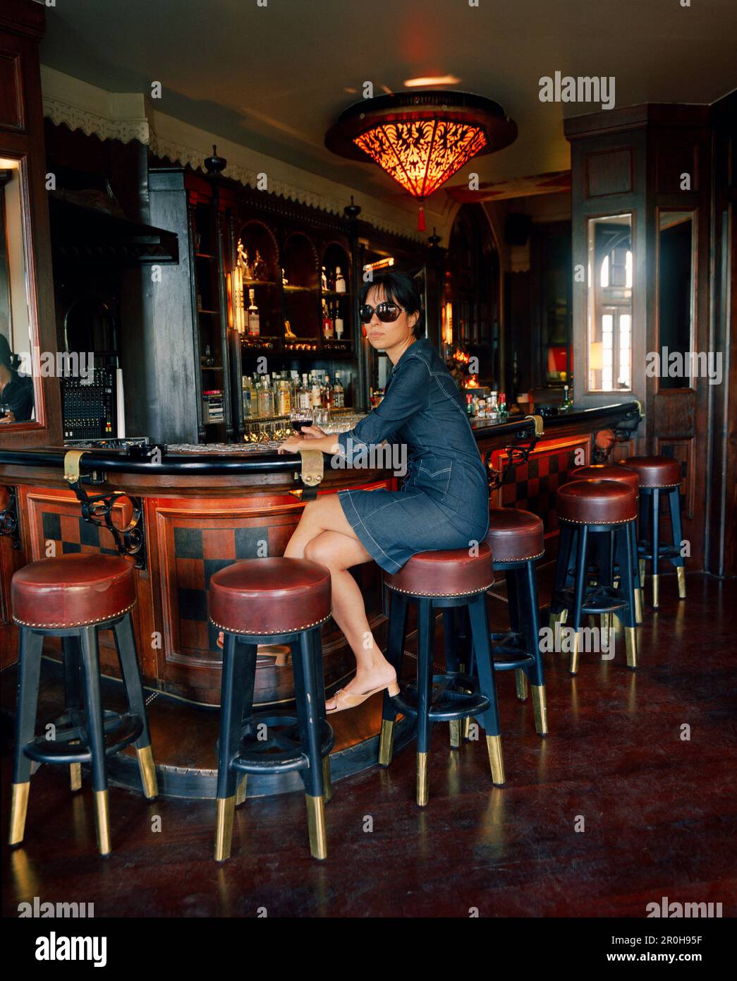 TURKEY, Istanbul, young female sitting at bar counter in Zihni ...