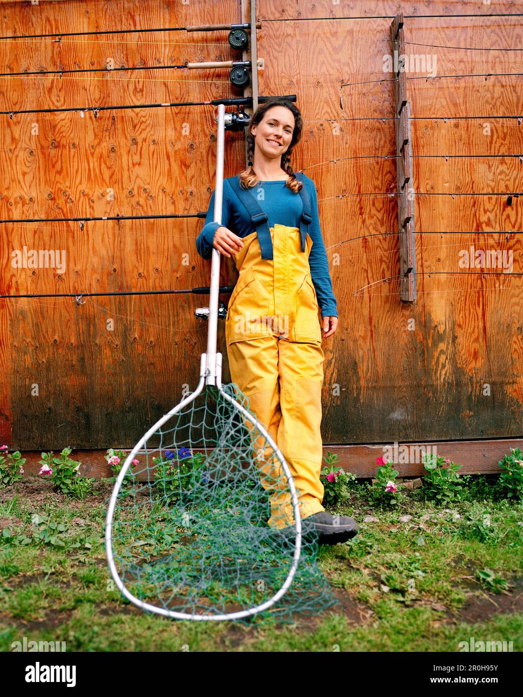 Young woman holding fishing pole hi-res stock photography and images ...