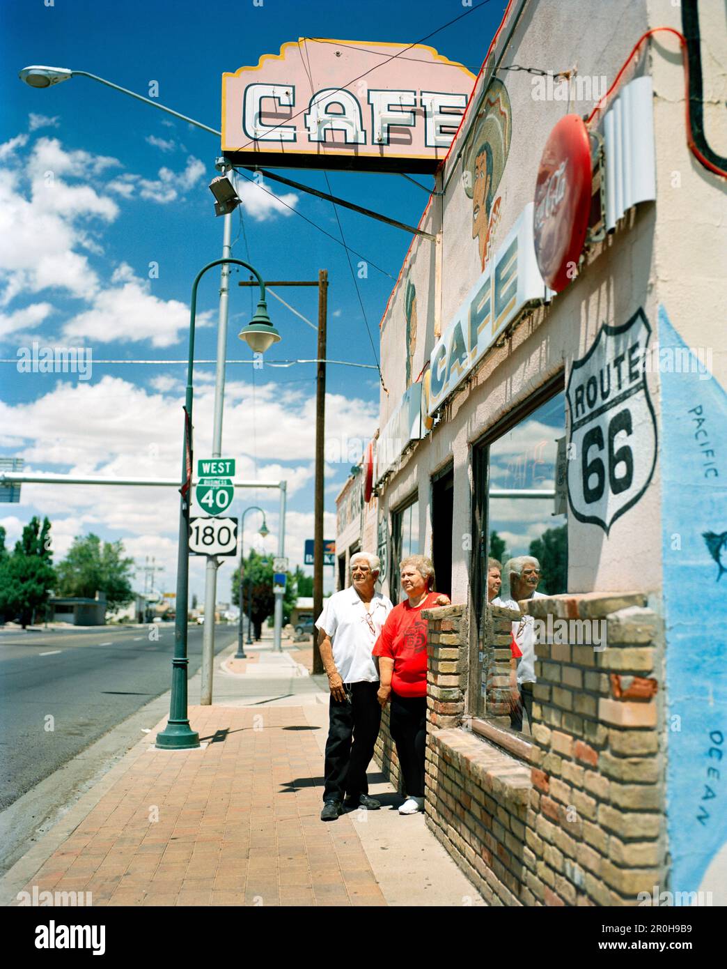 USA, Arizona, Holbrook, senior couple standing at entrance of the Route ...