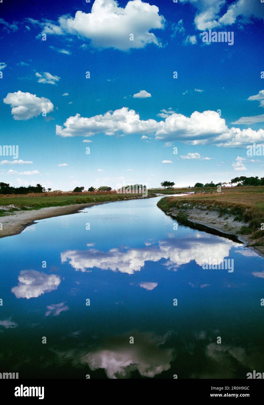 BOTSWANA, Africa, Okavango Delta, Clouds reflecting in the Okavango ...