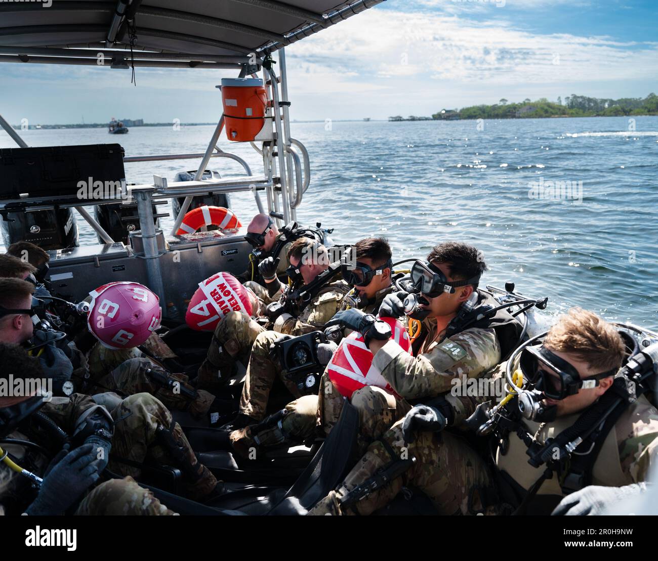 Students in the Air Force Combat Dive Course use compasses to navigate ...
