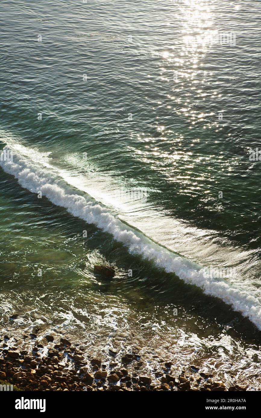 USA, California, Malibu, birds eye view of a wave breaking at Big Dume ...