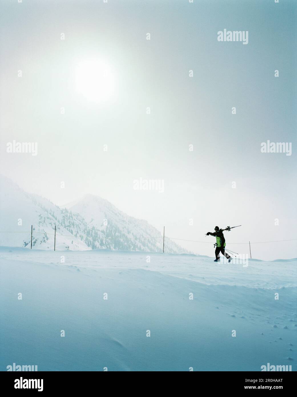 CANADA, skier walking with skiis at the top of the mountain, Kicking ...