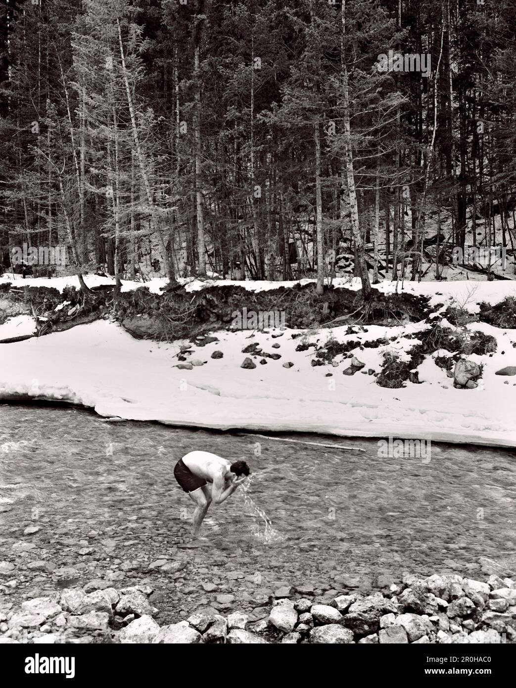CANADA, man washing face in the Lussier river, BC Rockies (B&W Stock ...