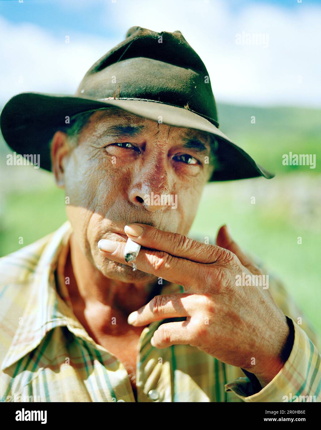 Cowboy smoking cigarette hi-res stock photography and images - Alamy