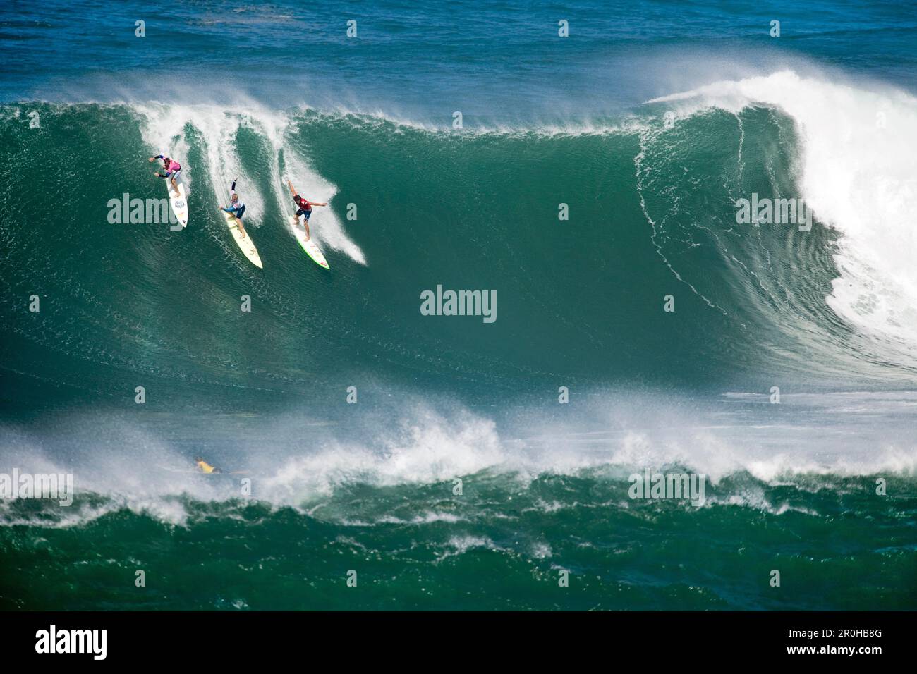 USA, Hawaii, the North Shore Oahu, surfers dropping in on a wave at ...
