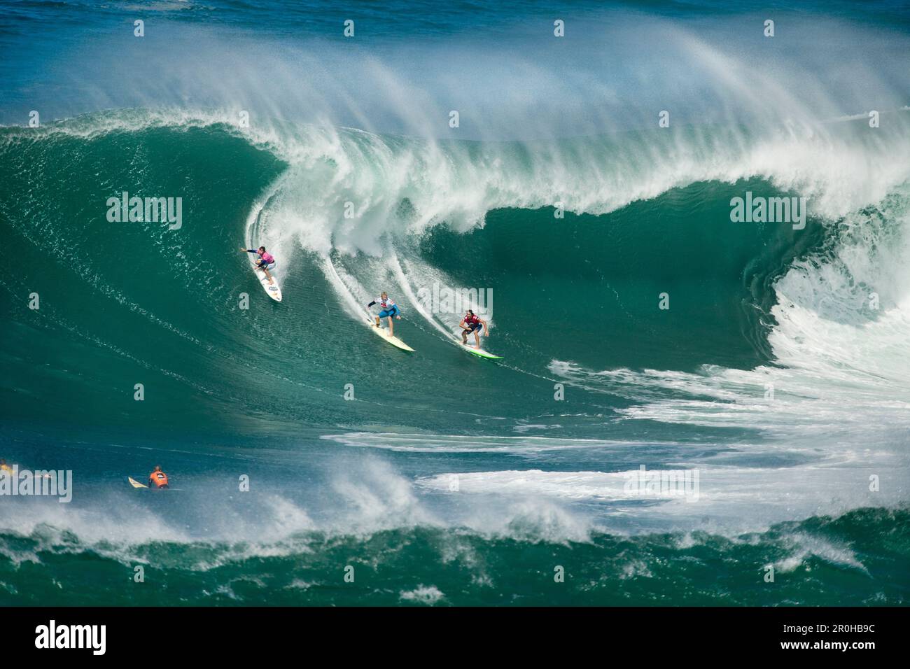 USA, Hawaii, the North Shore Oahu, surfers dropping in on a wave at ...