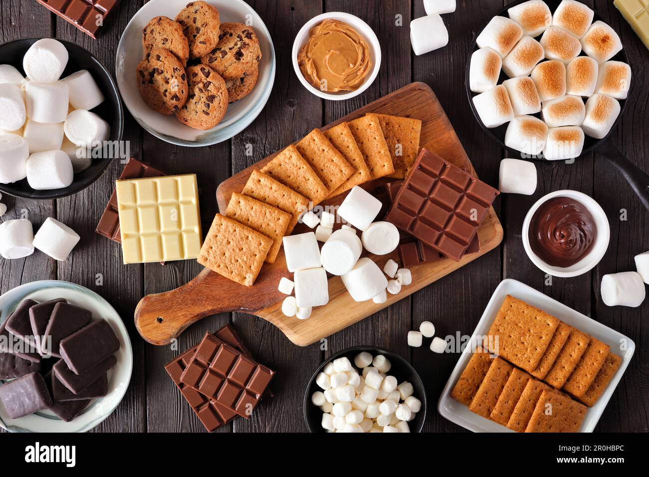 Smores buffet table scene. Roasted marshmallows, crackers, chocolate ...