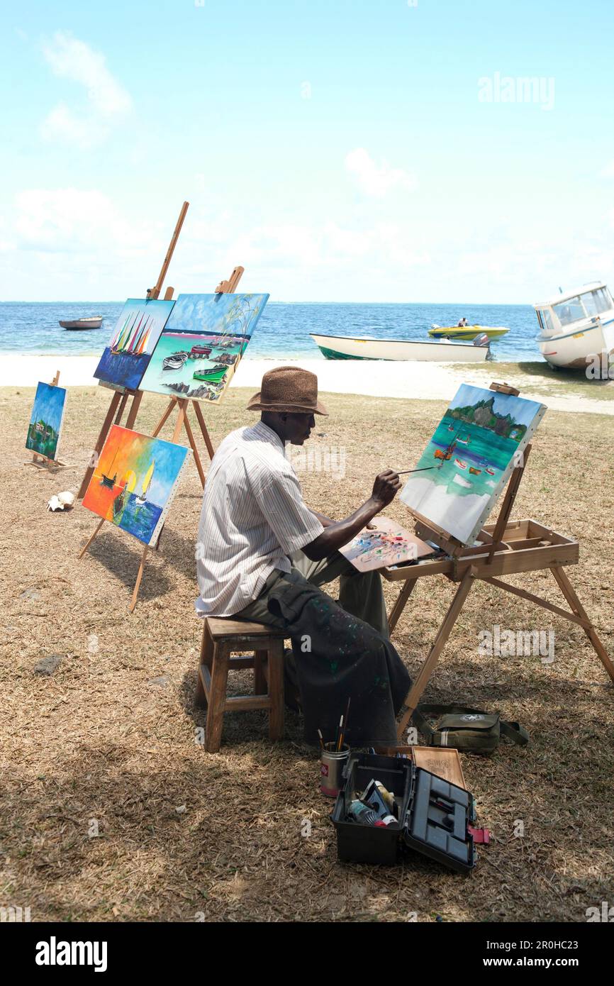 MAURITIUS, an artist creates and sells his paintings by the water in ...