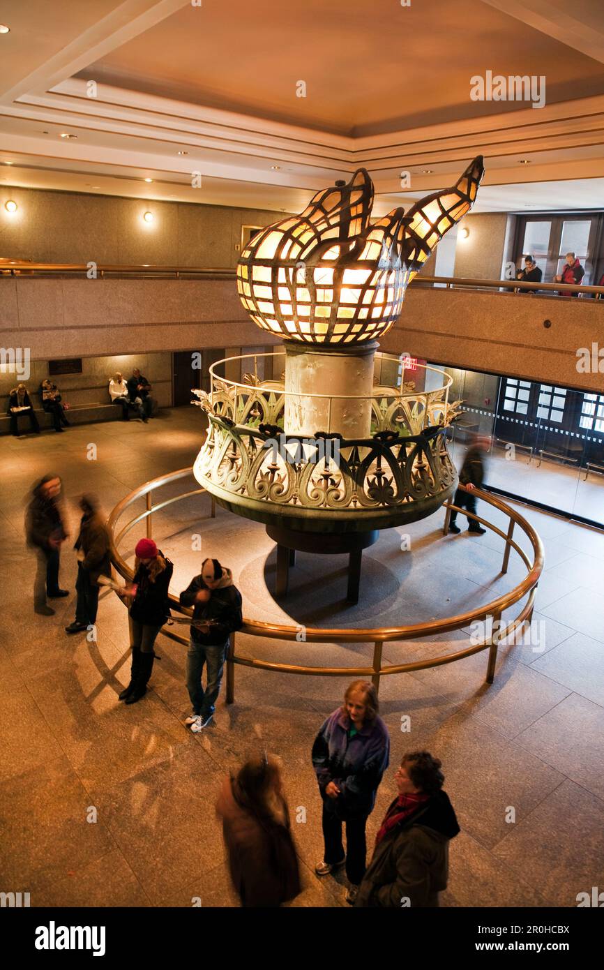 USA, New York, tourists in the Statue of Liberty Museum observing the ...