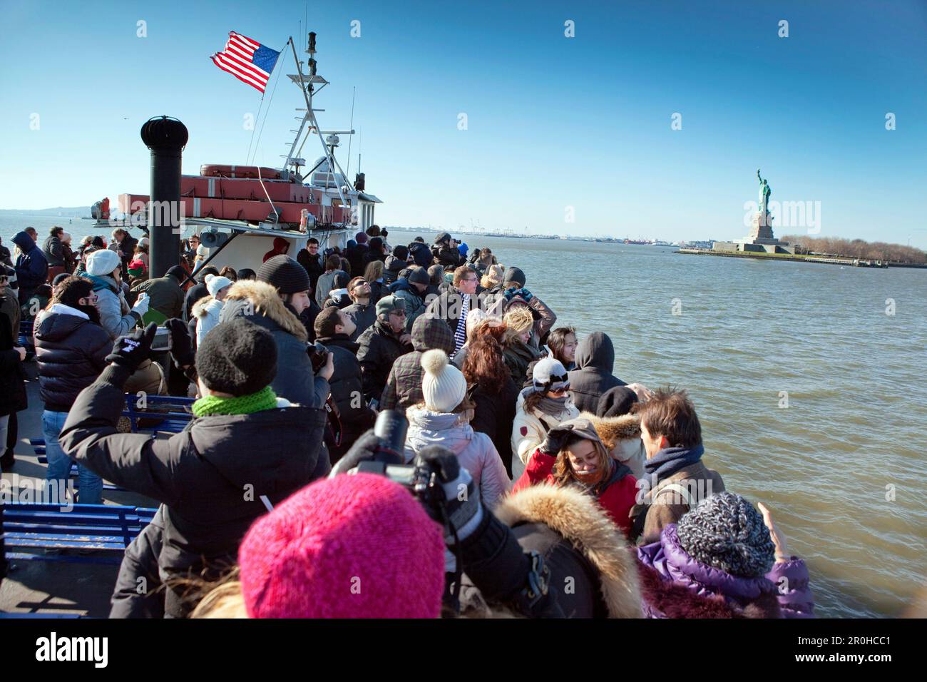 USA, New York, tourists on a boat tour to visit the Statue of Liberty ...