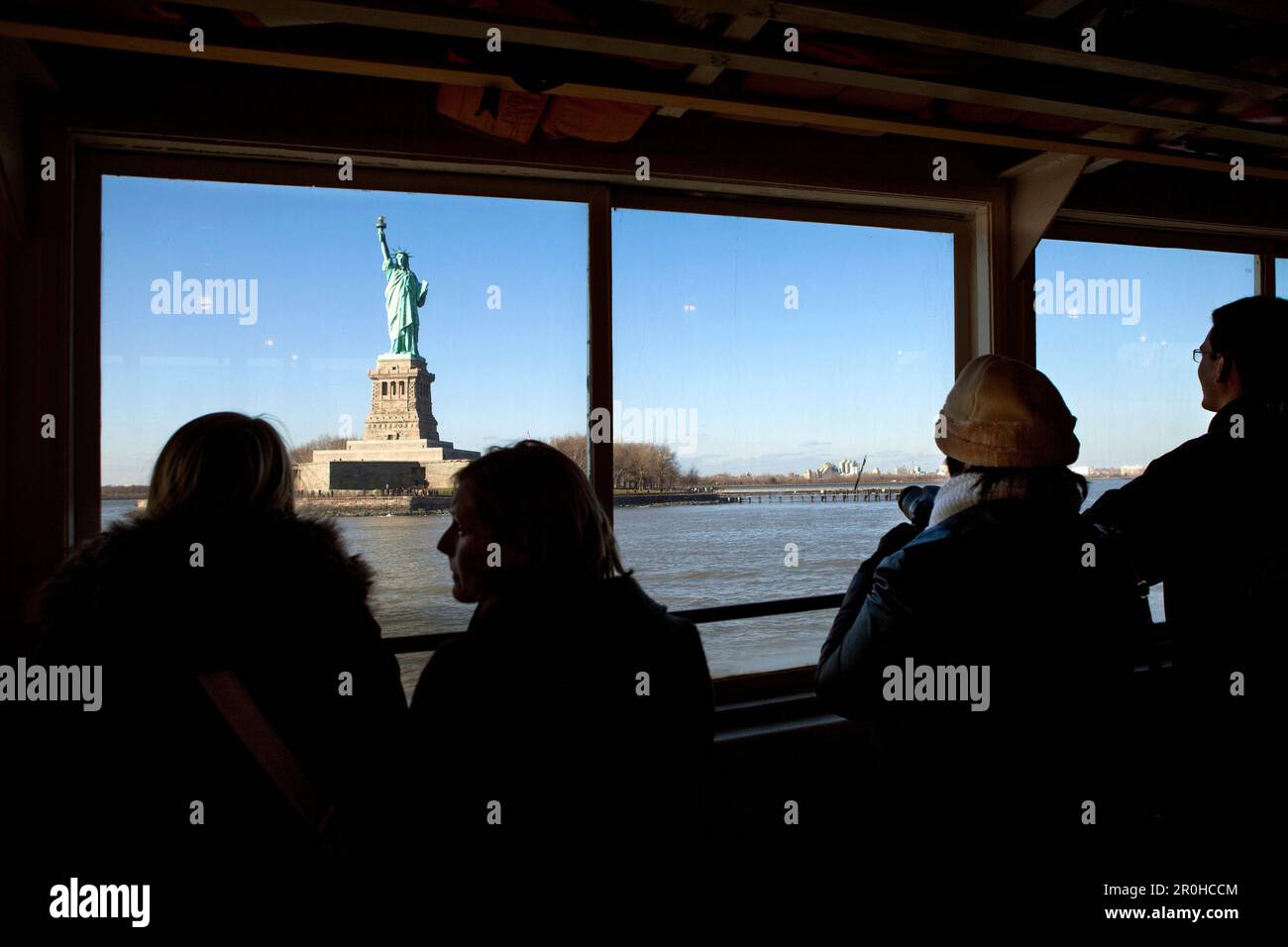 USA, New York, tourists taking a boat tour to visit the Statue of ...