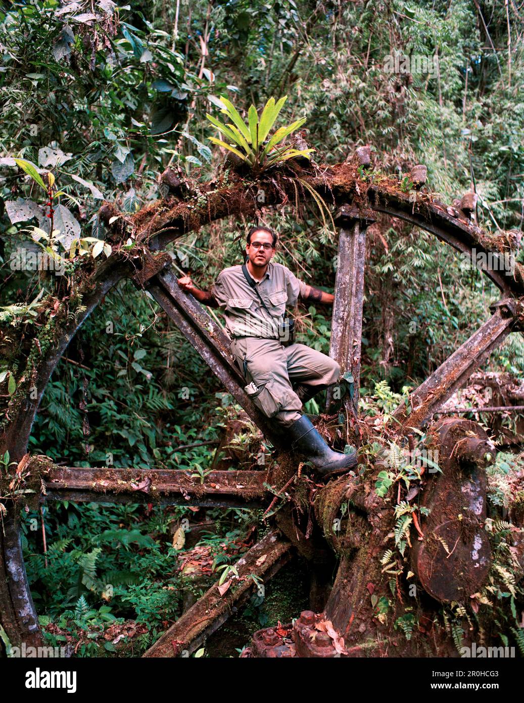 PANAMA, Cana, a scientist sits in an old gear that was part of a gold ...