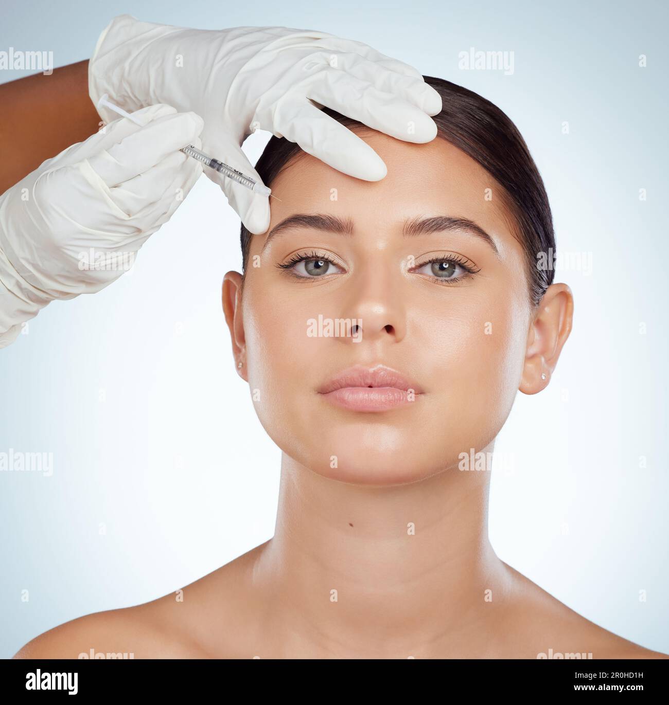 Closeup portrait of woman getting facial fillers or botox. Young ...