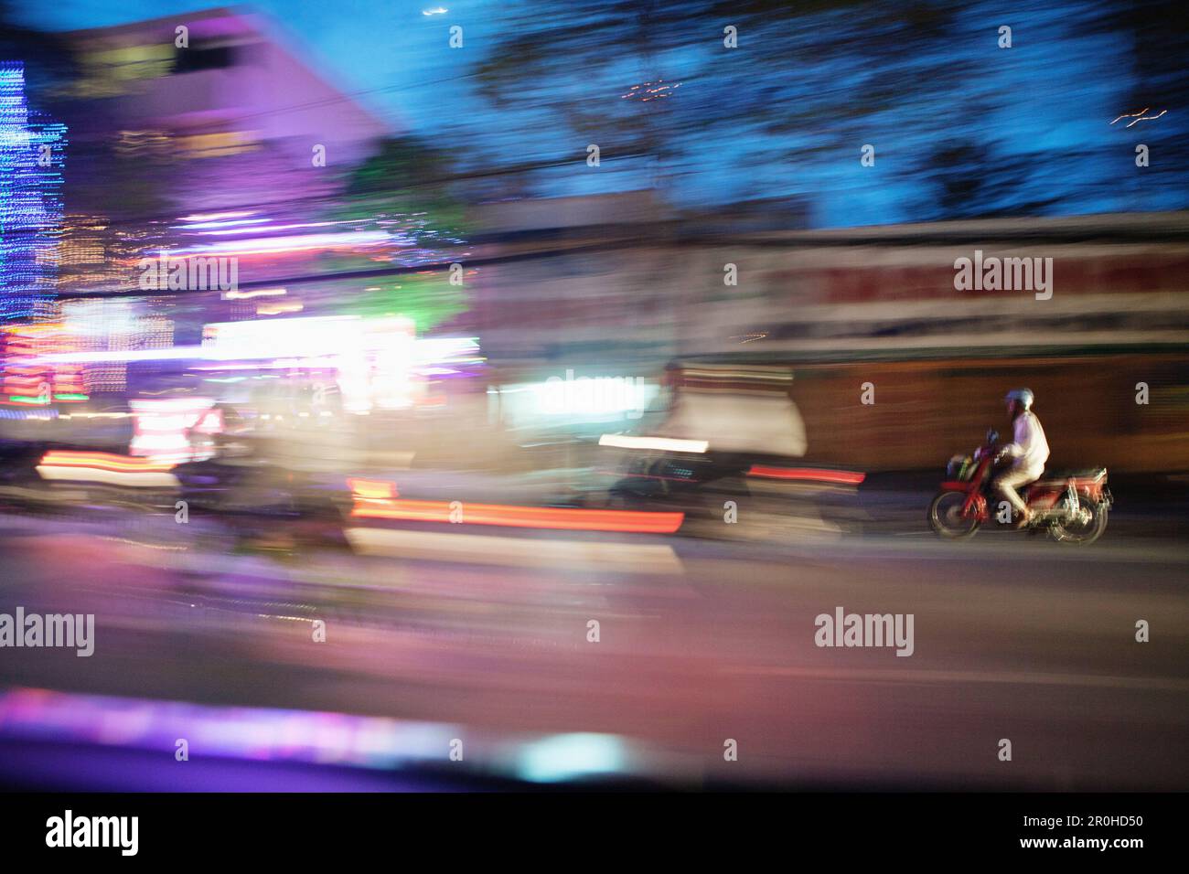 VIETNAM, Saigon, Ho Chi Minh City, mopeds speed through the city at ...