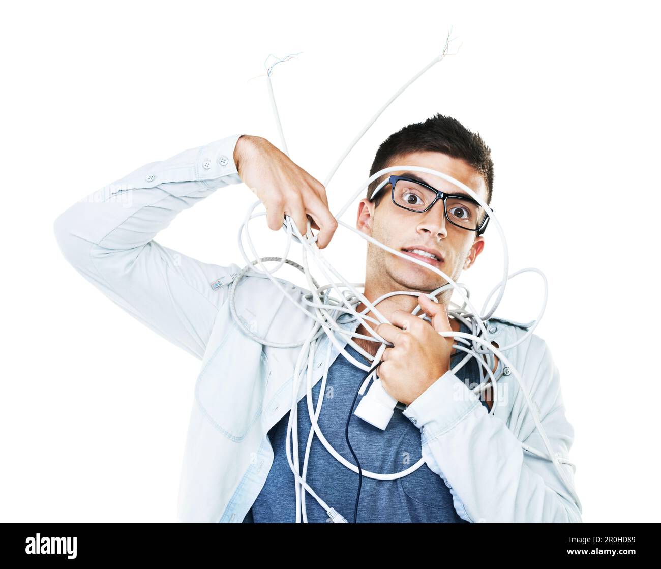 Too many wires so little time. Studio portrait of a young man wrapped ...