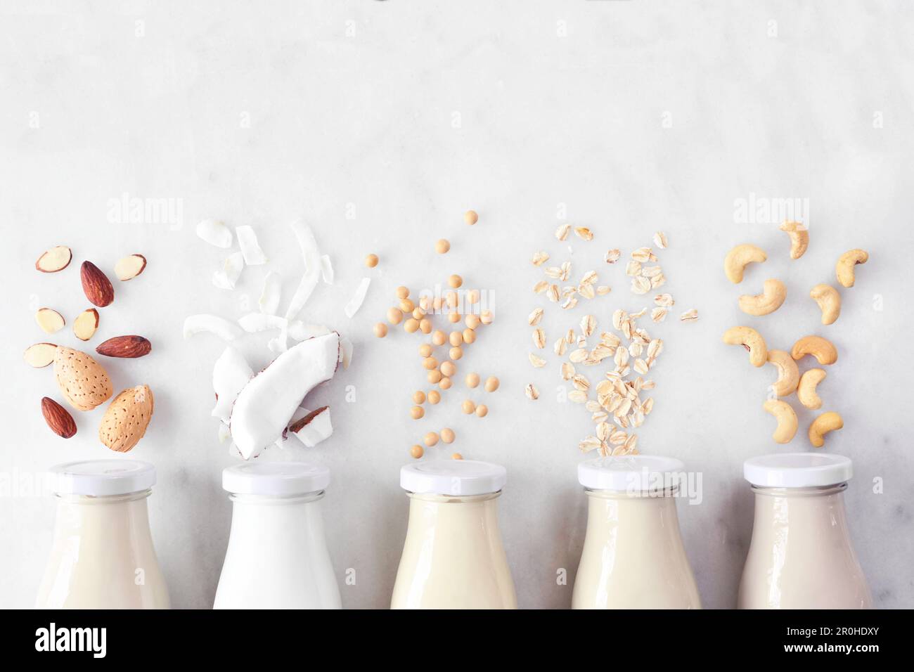 Vegan, plant based, non dairy milk. Variety in milk bottles with ...