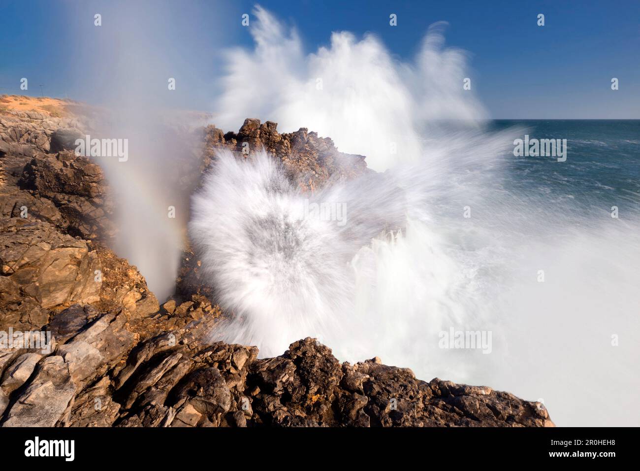 Waves in the Atlantic Ocean carving out rock cavities at the foot of ...