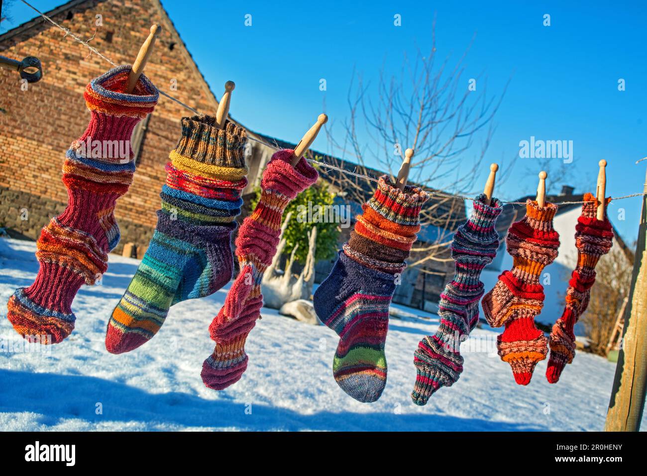 wool socks on clothesline in a winter garden Stock Photo - Alamy