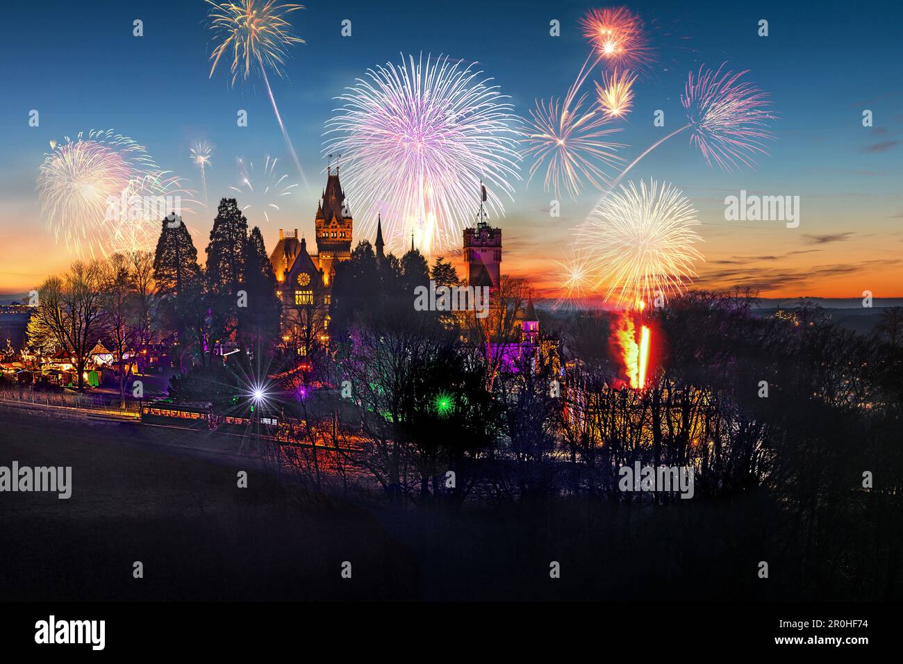 fireworks over colourful illuminated castle Drachenburg in Sieben ...