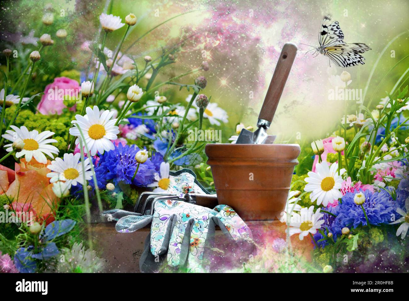 colourful flowers at a planting desk with flowerpot, chovel and garden ...