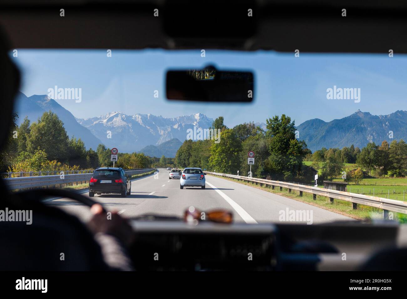 View through a windshield on freeway A95 with Wetterstein mountain ...