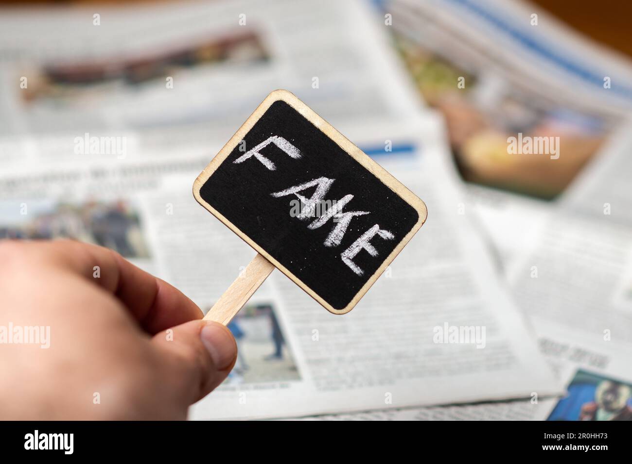 Fake news concept. Sign with the inscription fake on the background of ...