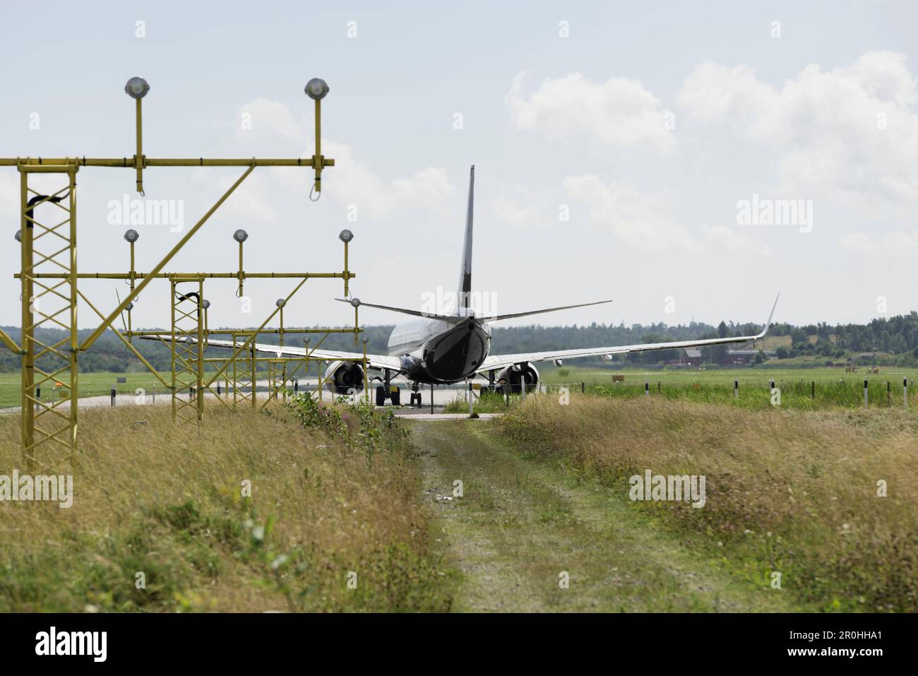 A Boeing 737 at a small airport Stock Photo - Alamy