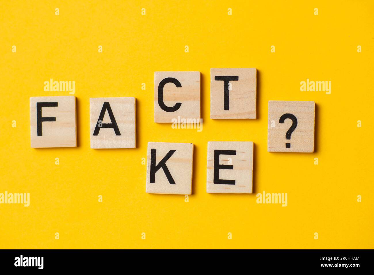 fact or fake words with a question on a yellow background Stock Photo ...