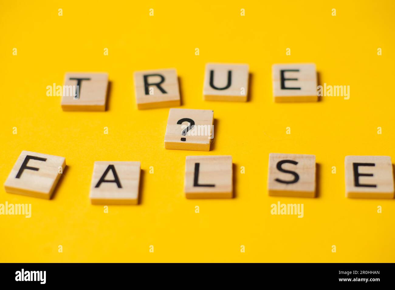 True or false words on a yellow background with a question mark. Choice ...