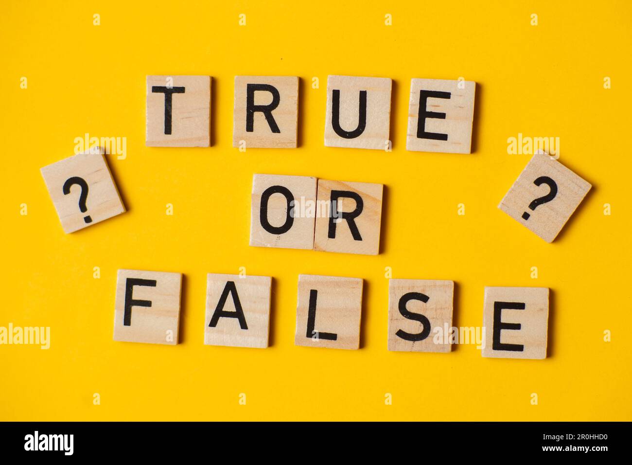 True or false words on a yellow background with a question mark. Choice ...