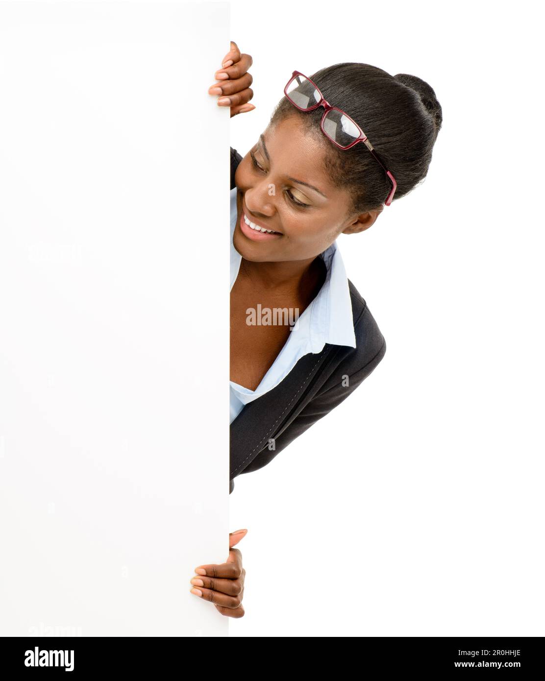 Oh, hello there...a young businesswoman standing behind a blank sign ...