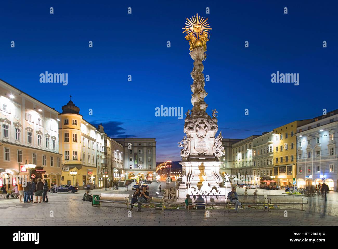 Main square in the evening with the baroque Holy Trinity column, also ...