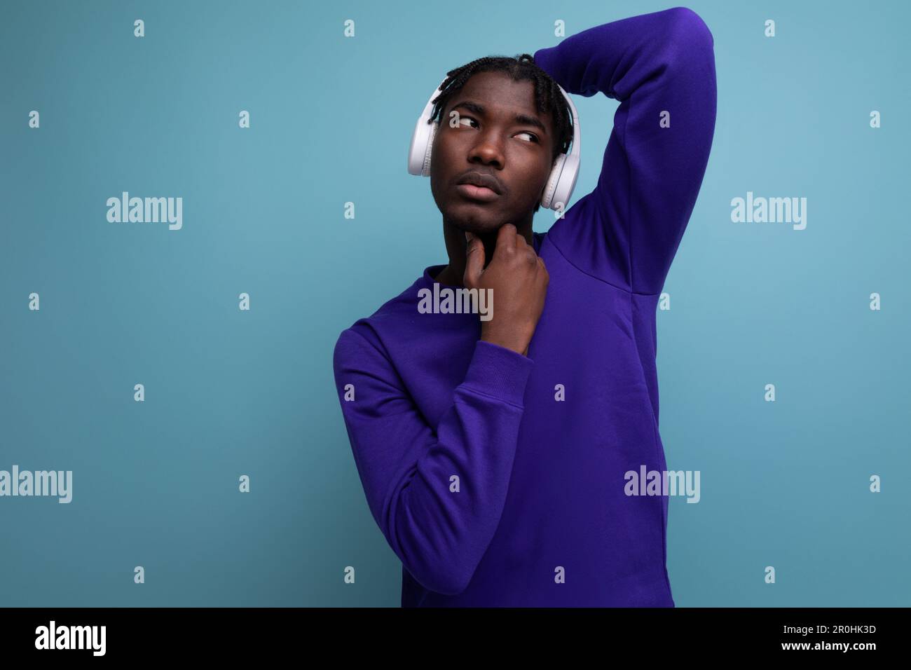 well-groomed dark-skinned European young brunette man with dreadlocks ...