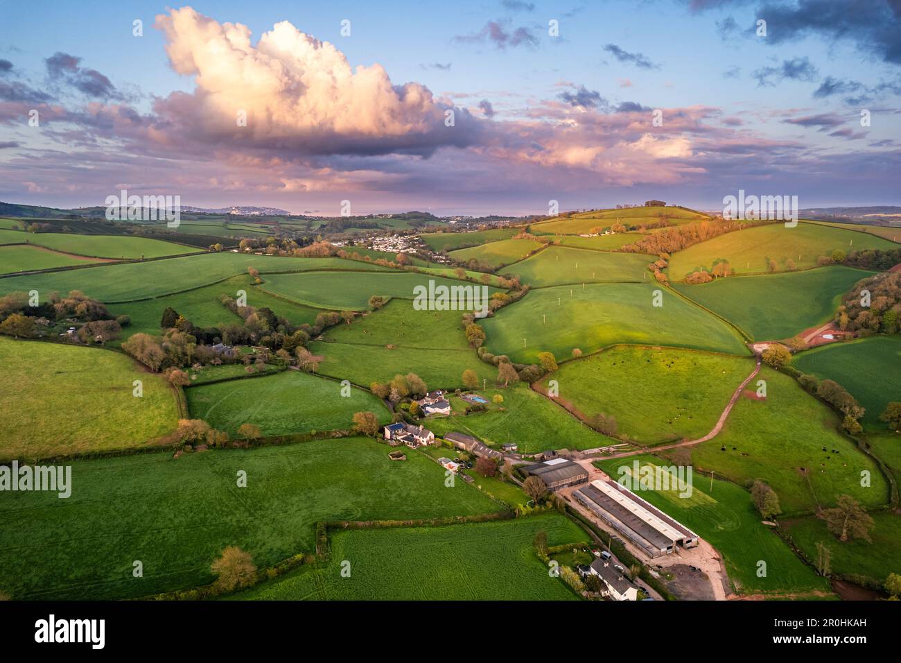 Sunset over Fields and Farmlands in spring from a drone, Devon, England ...