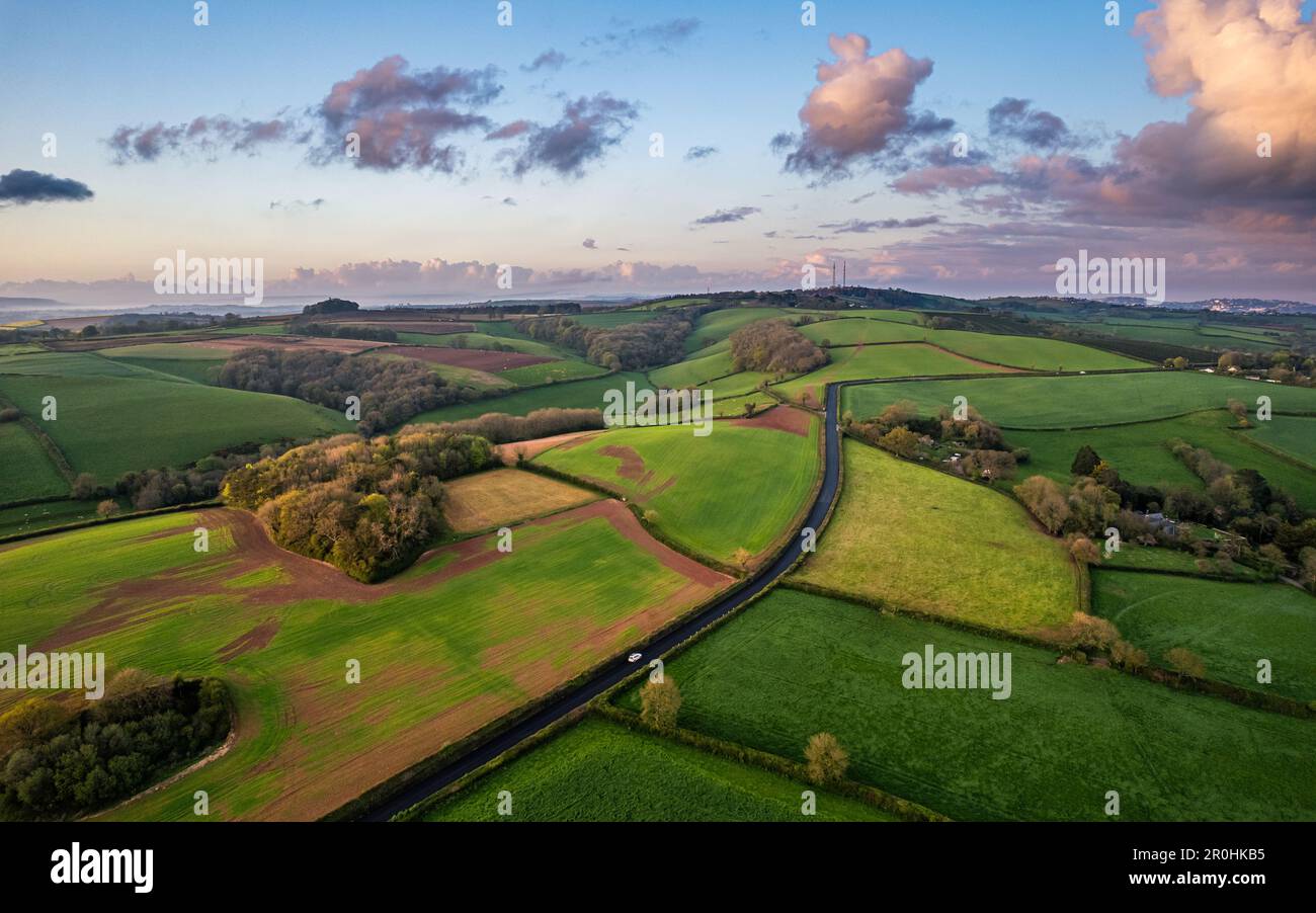 Sunset over Fields and Farmlands in spring from a drone, Devon, England ...