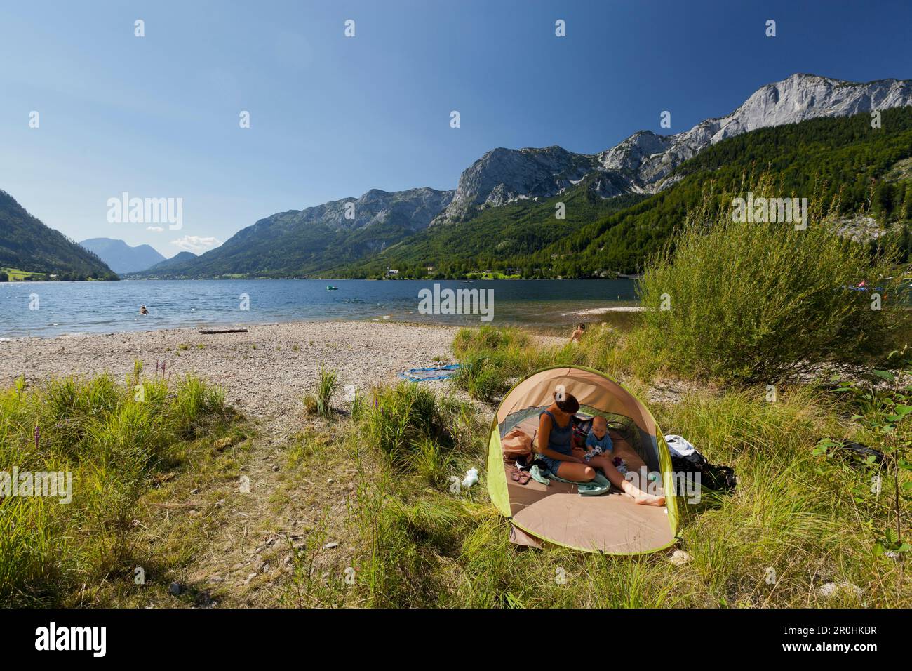 Mother and baby in a sun shelter at lake Grundlsee, Goeßl ...