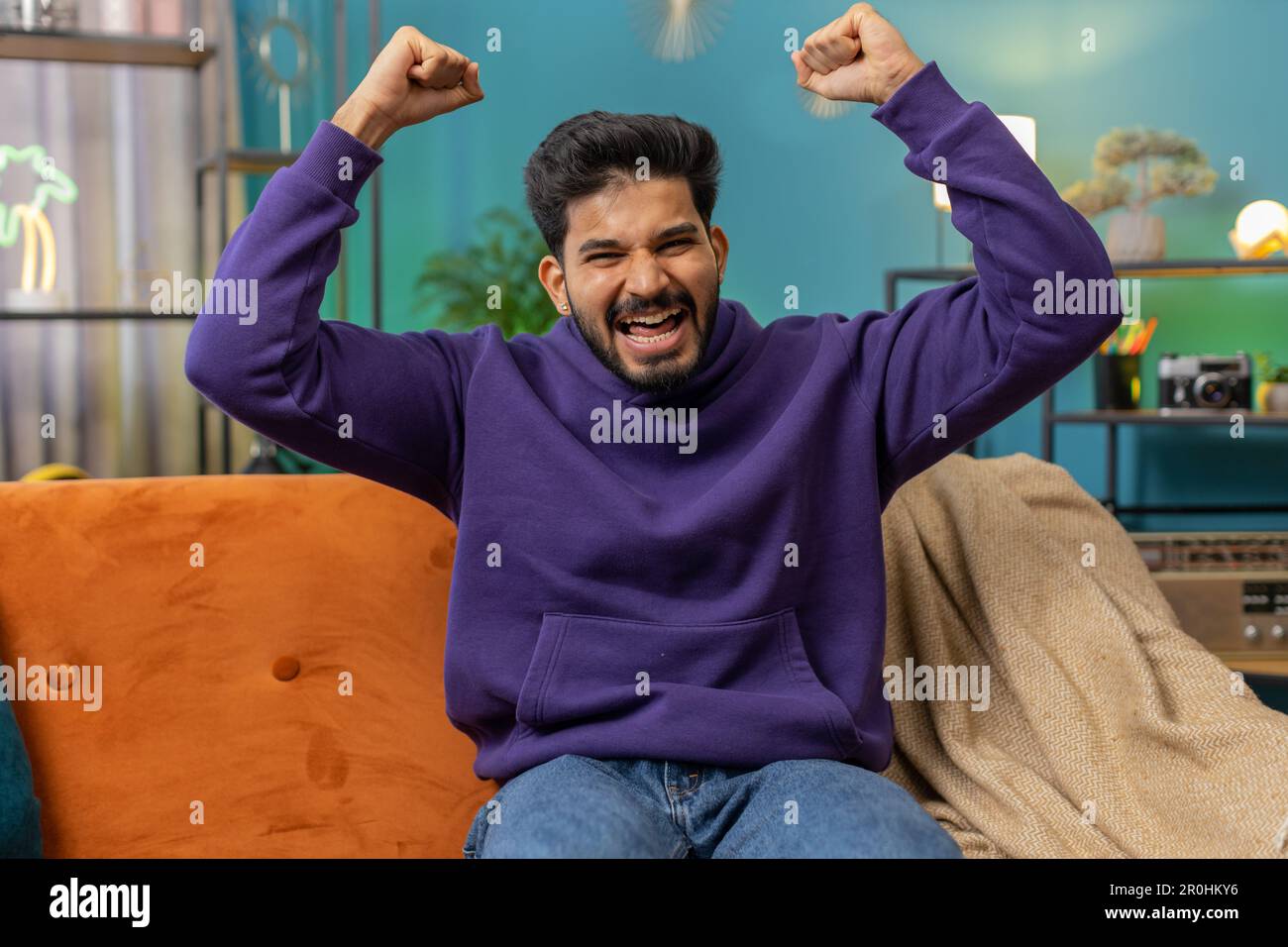 Happy indian man shouting, celebrating success, winning, goal ...